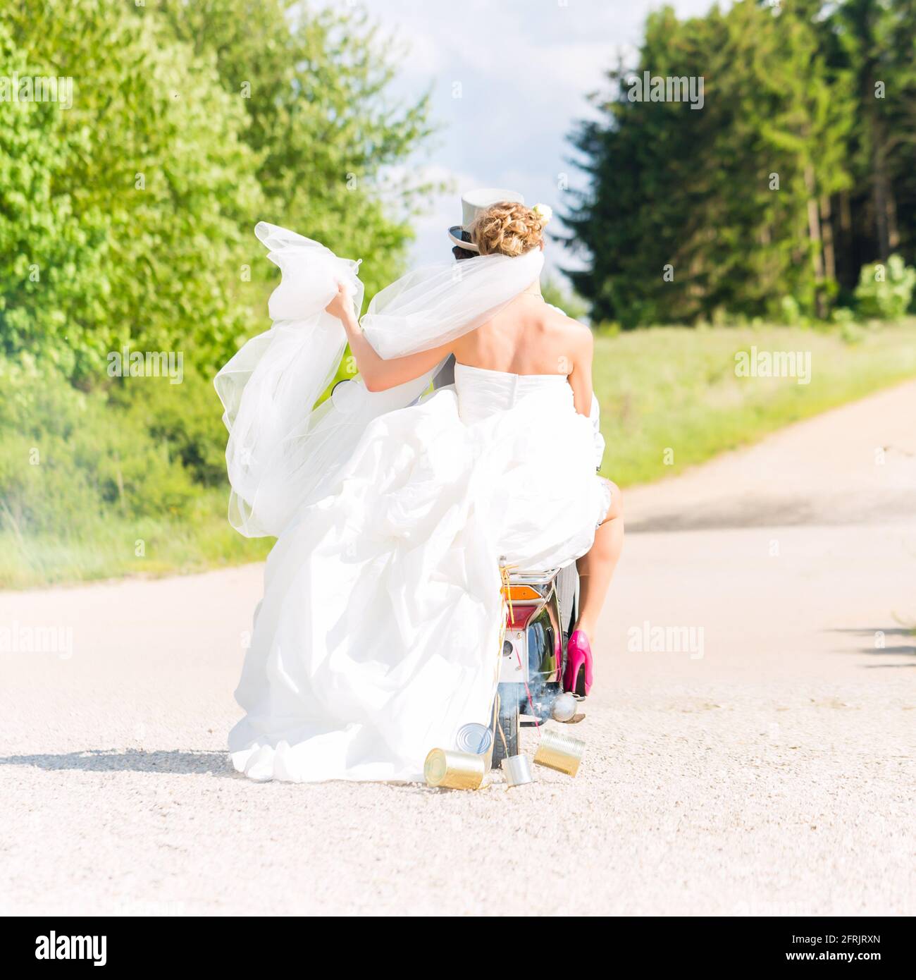 Wedding groom and bride driving motor scooter having fun Stock Photo ...