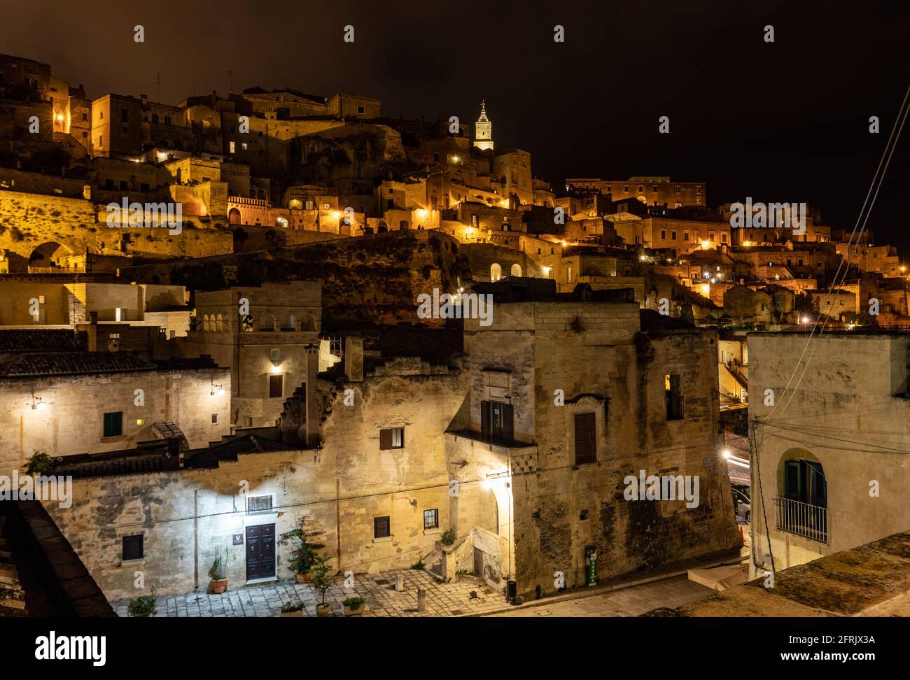 Amazing lighted buildings in ancient Sassi district by night in Matera ...