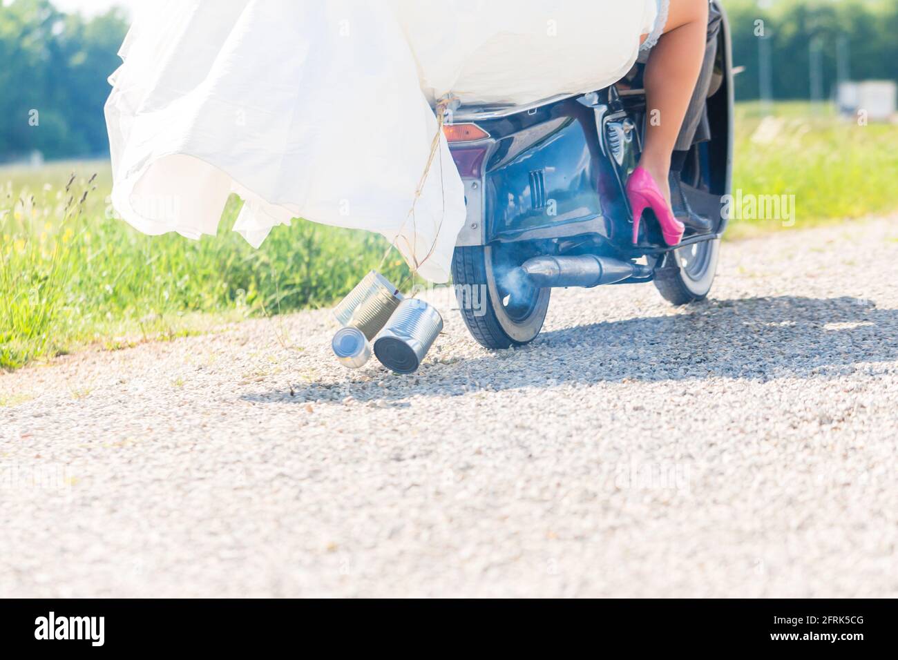 Wedding groom and bride driving motor scooter having fun Stock Photo ...