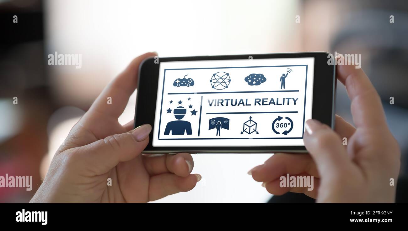 Hand holding a smartphone with virtual reality concept Stock Photo - Alamy