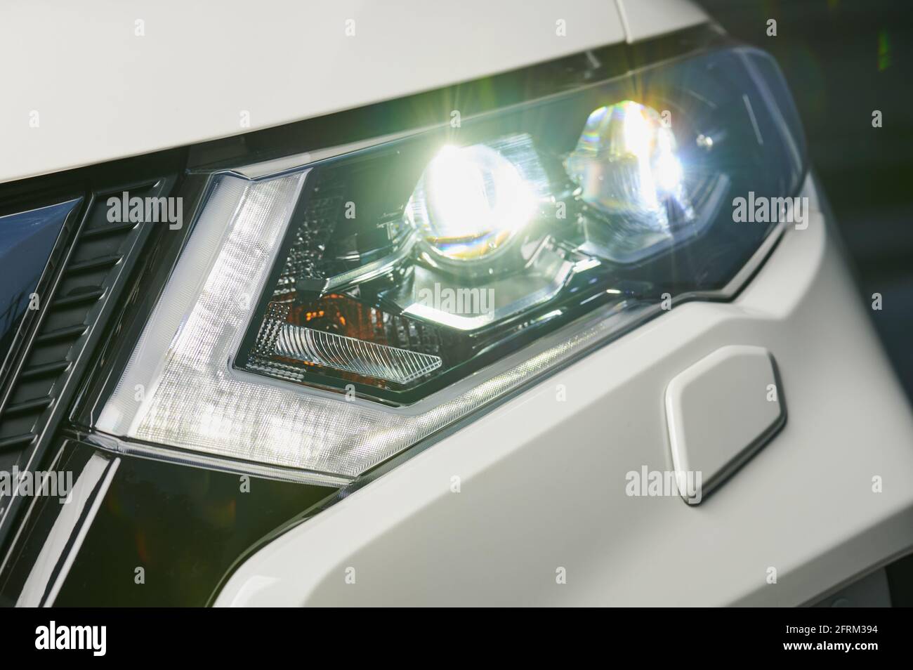 Front view of lights in car headlight close up view Stock Photo - Alamy