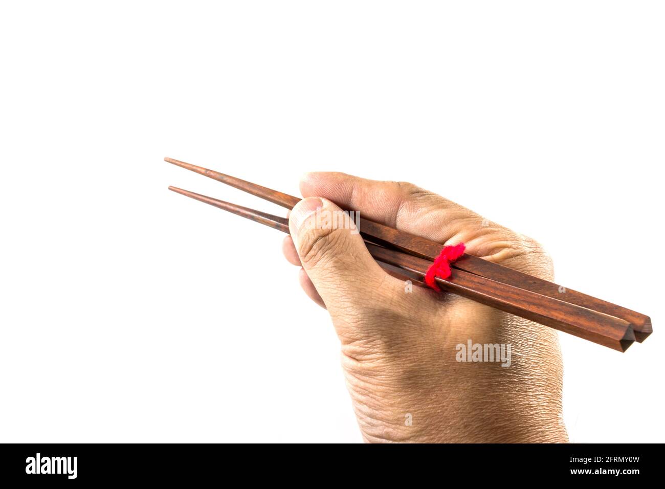 Male hand holding chopsticks isolated on white background Stock Photo ...