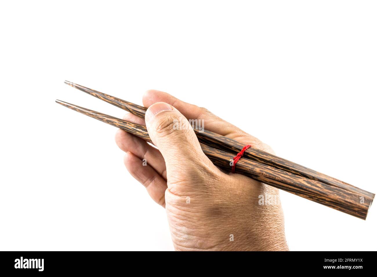 Male hand holding chopsticks isolated on white background Stock Photo ...