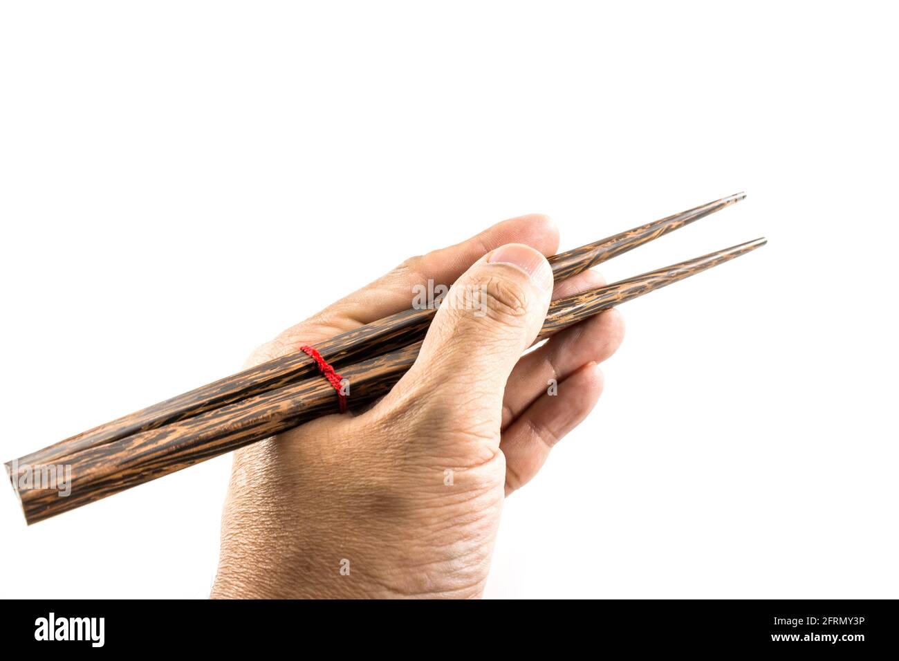 Male hand holding chopsticks isolated on white background Stock Photo ...
