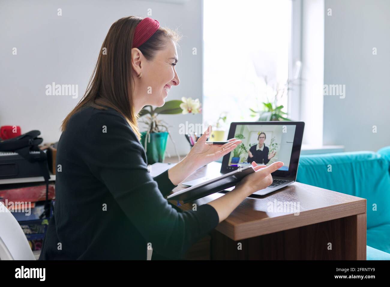 Woman teacher teaching student teenager online using video call on ...