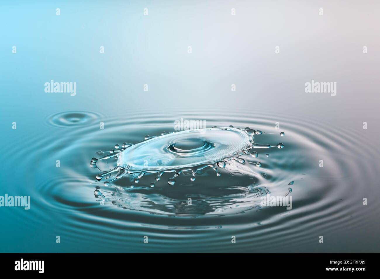 Collision ripple splash of two drops falling into the water Stock Photo ...