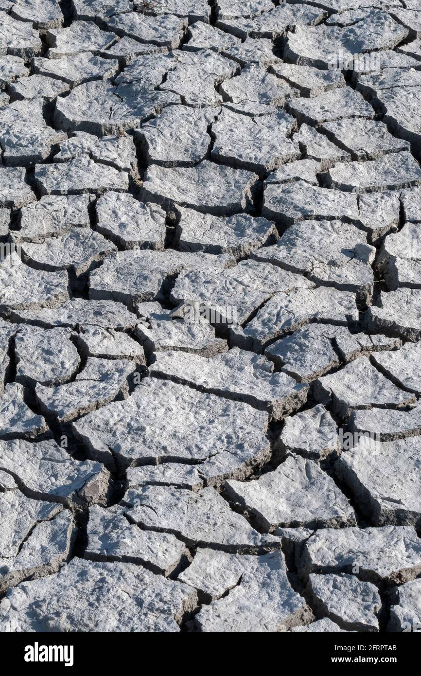 Barren cracked land during prolonged dry spell Stock Photo - Alamy