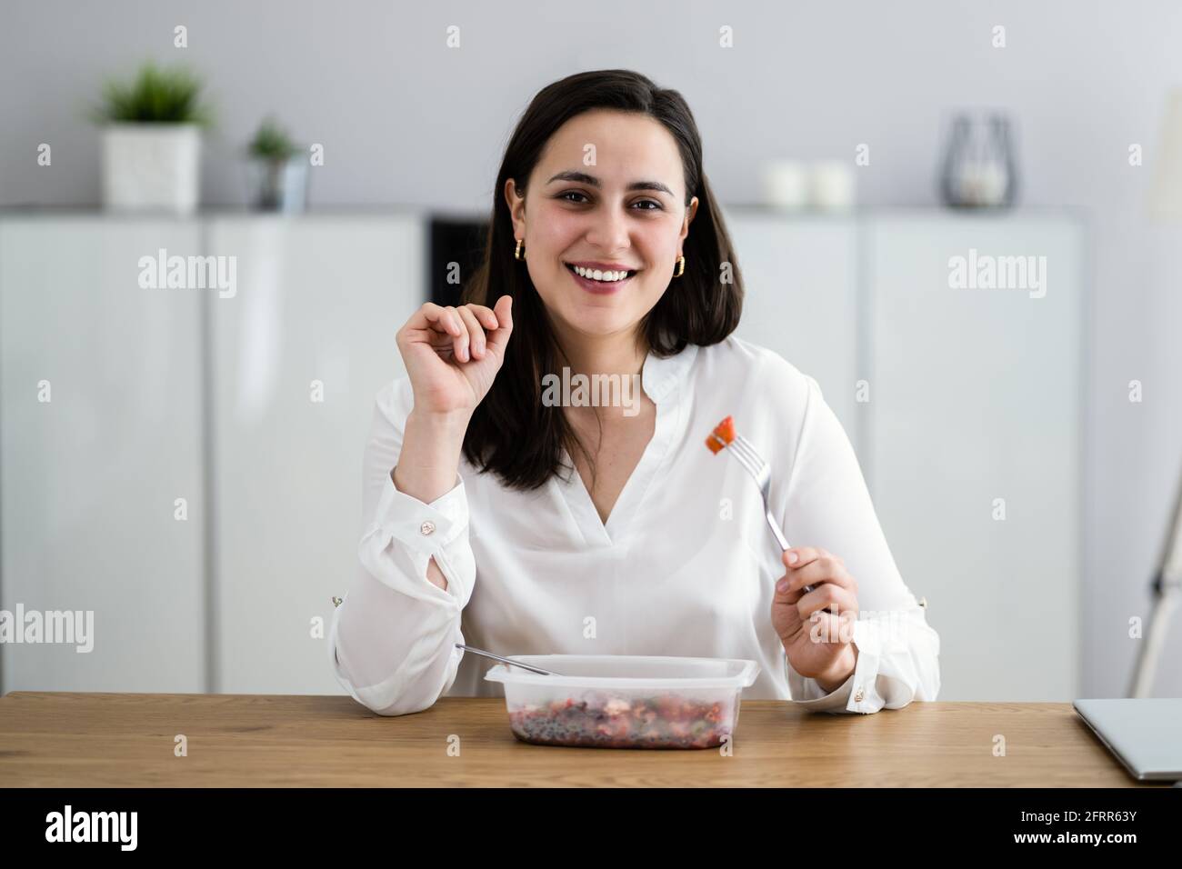 Woman tasting food hi-res stock photography and images - Alamy