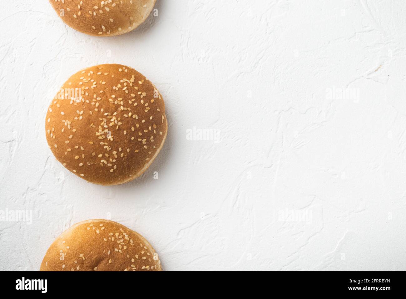 Burger round buns for making fast food sandwiches set, on white stone ...