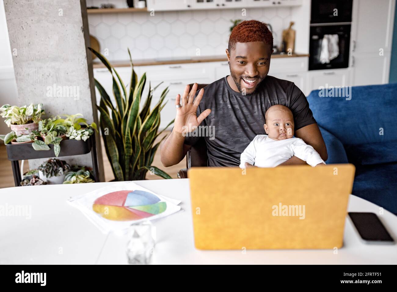 Happy african father with small cute little child sit in living room ...