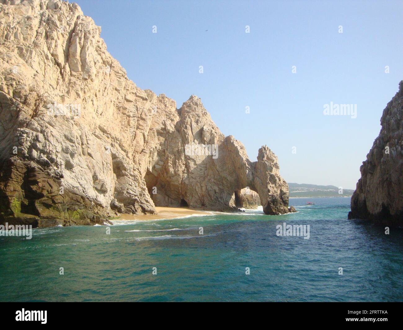 Rugged rocky landscape with El Arco where the Pacific Ocean meets the ...