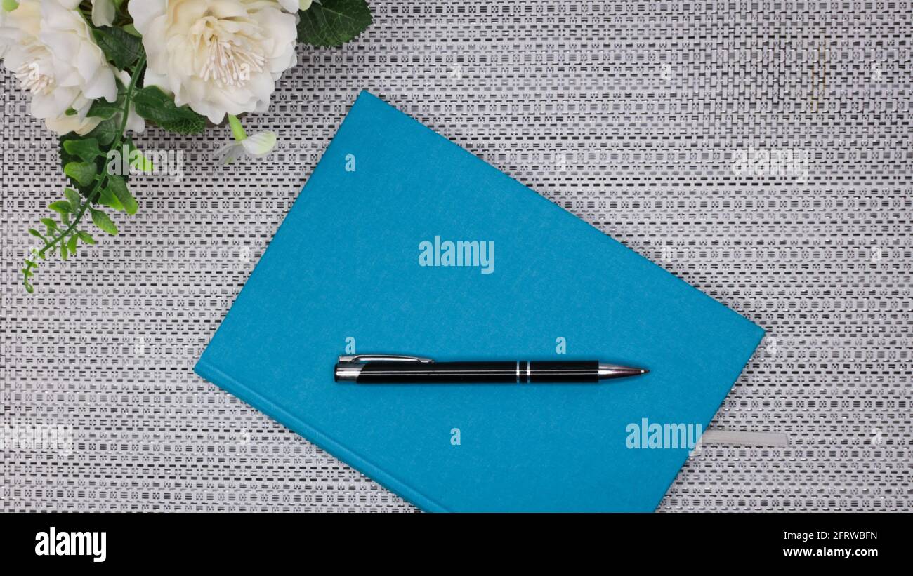 wonderful wallpaper with turquoise blue day planner, black pen and ...