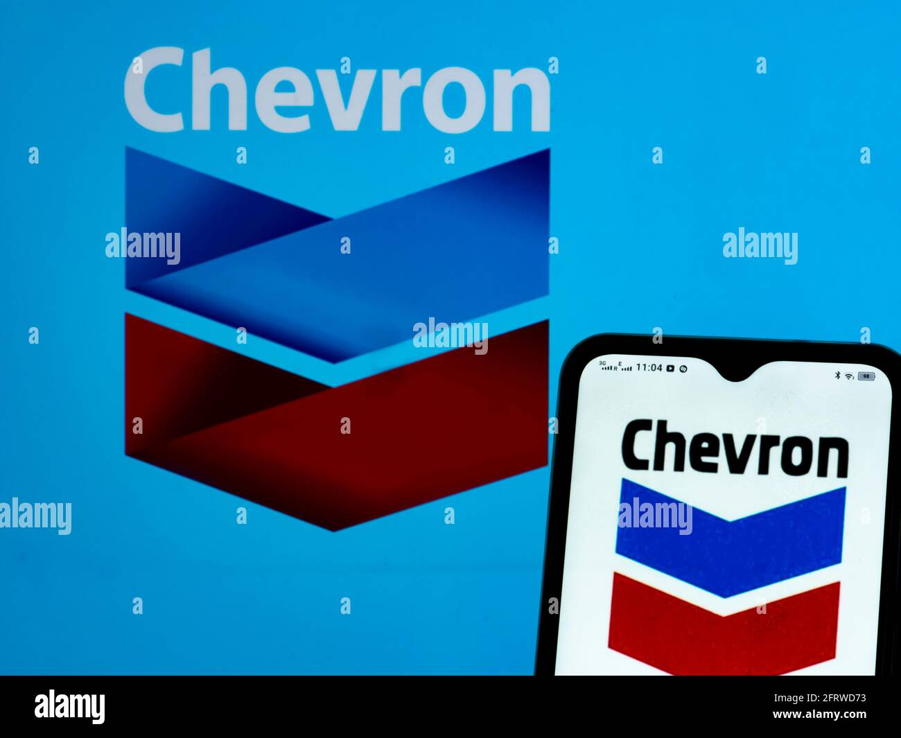 In this photo illustration Chevron Corporation logo seen displayed on a ...