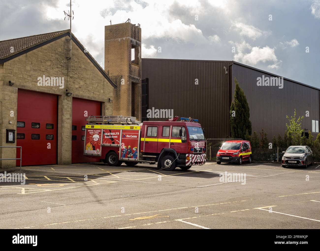 The front of a British fire station with one fire engine parked outside ...