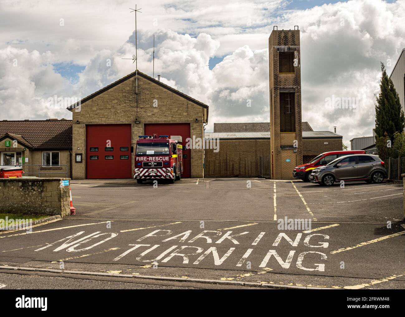 The front of a British fire station with one fire engine parked outside ...