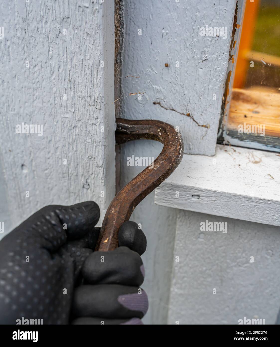 Crowbar held in hands while breaking down the wooden wall Stock Photo ...