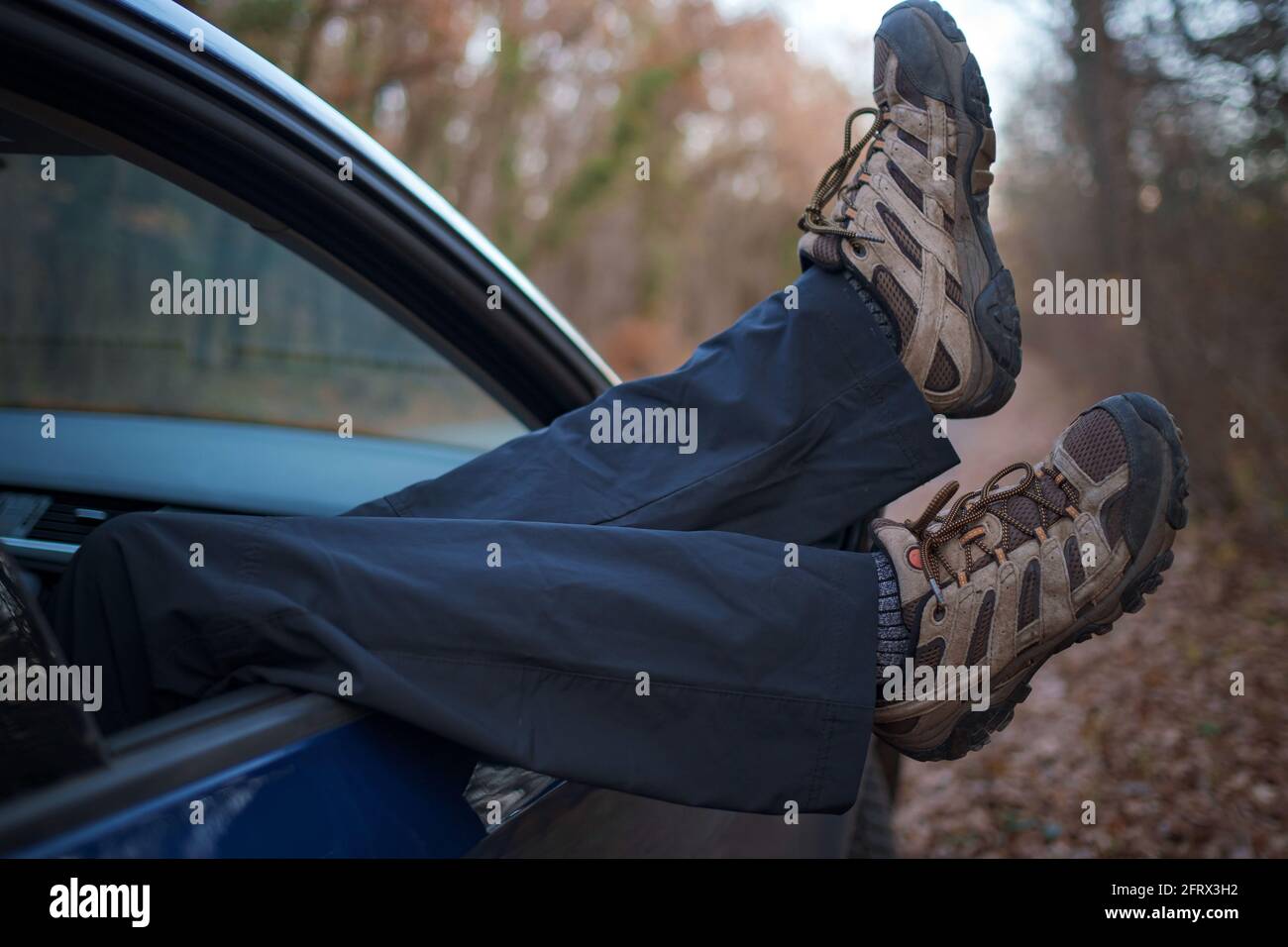 Man feet sticking out car hi-res stock photography and images - Alamy
