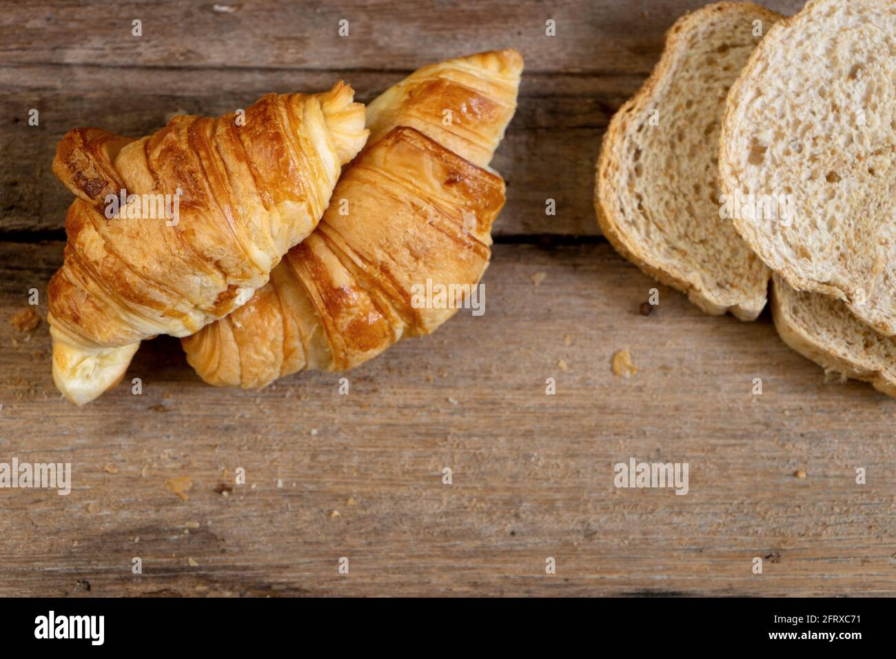 Freshly baked French croissant bakery on teak wood table with copy ...