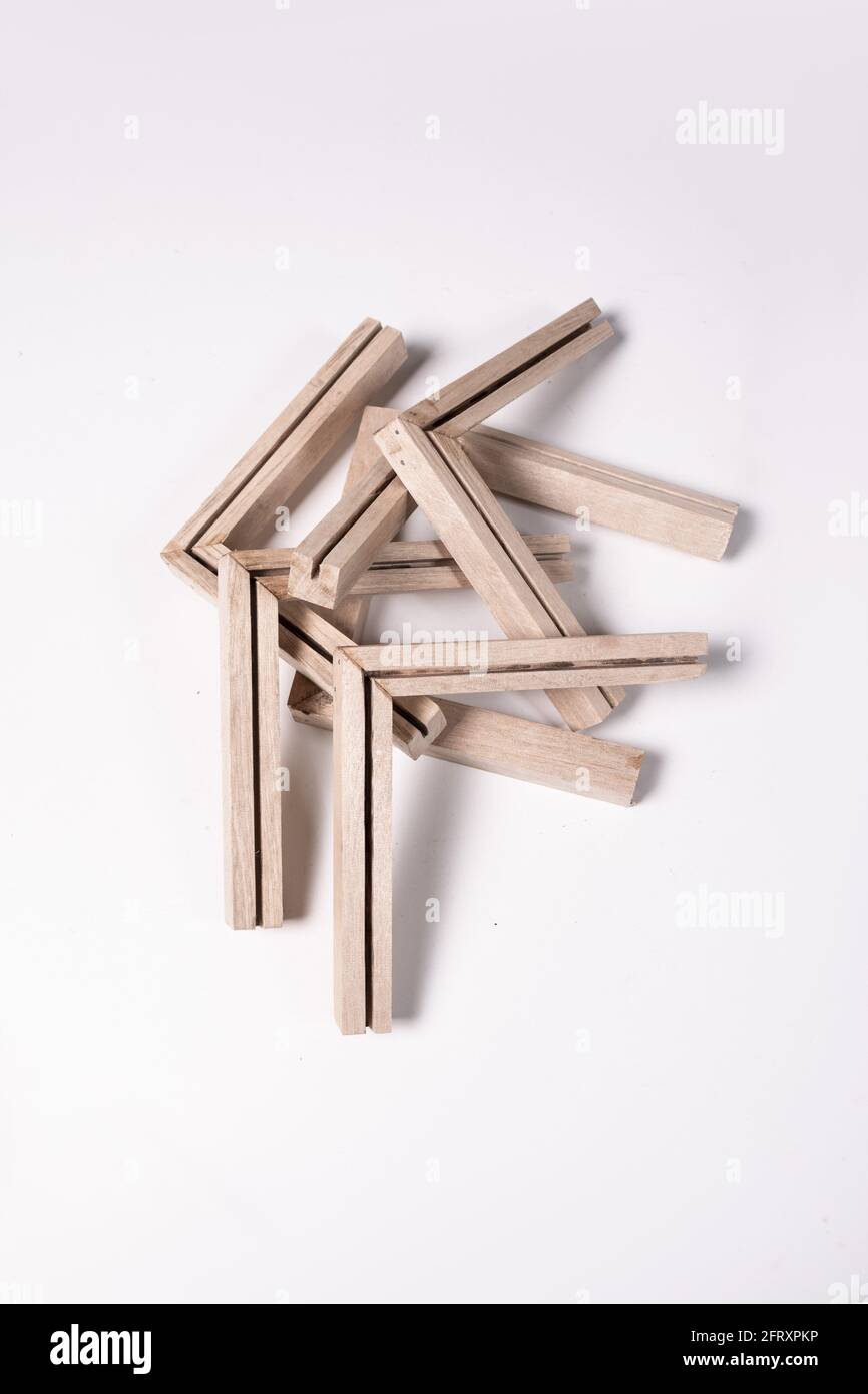 Wooden L-shaped brackets isolated on white background Stock Photo - Alamy