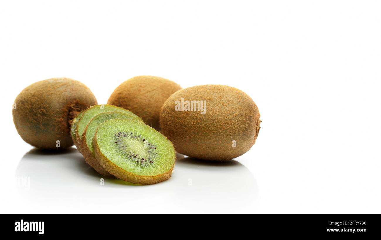 Ripe kiwi fruit, whole and sliced kiwi isolated on white background ...