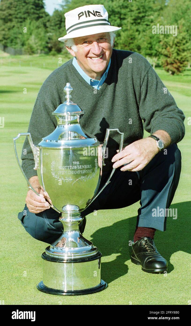 Winner Neil Coles with the Scottish Seniors trophy at Dalmahoy today ...