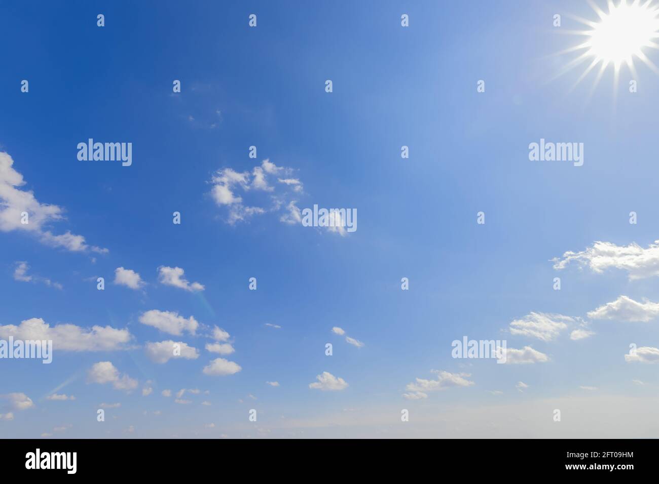Perspective blue sky with clouds and sun on the right (light on the ...