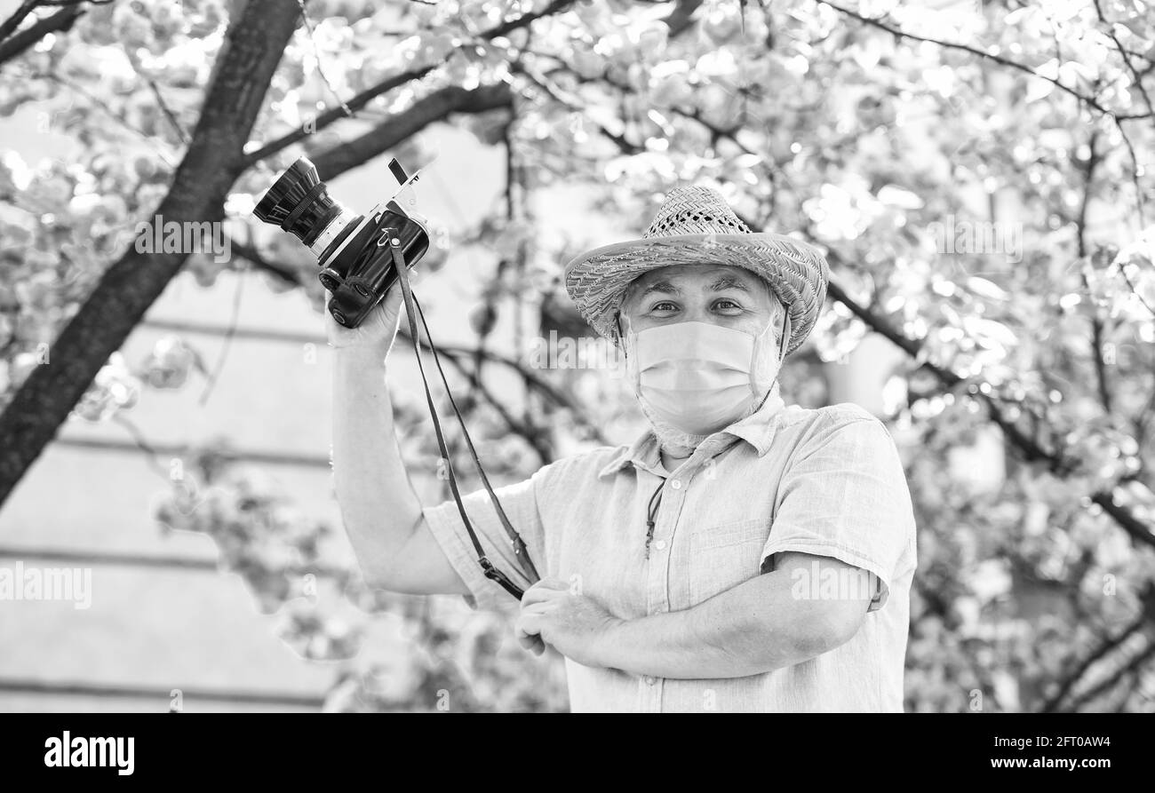 man tourist use camera take photo of cherry blossom. sakura in full ...