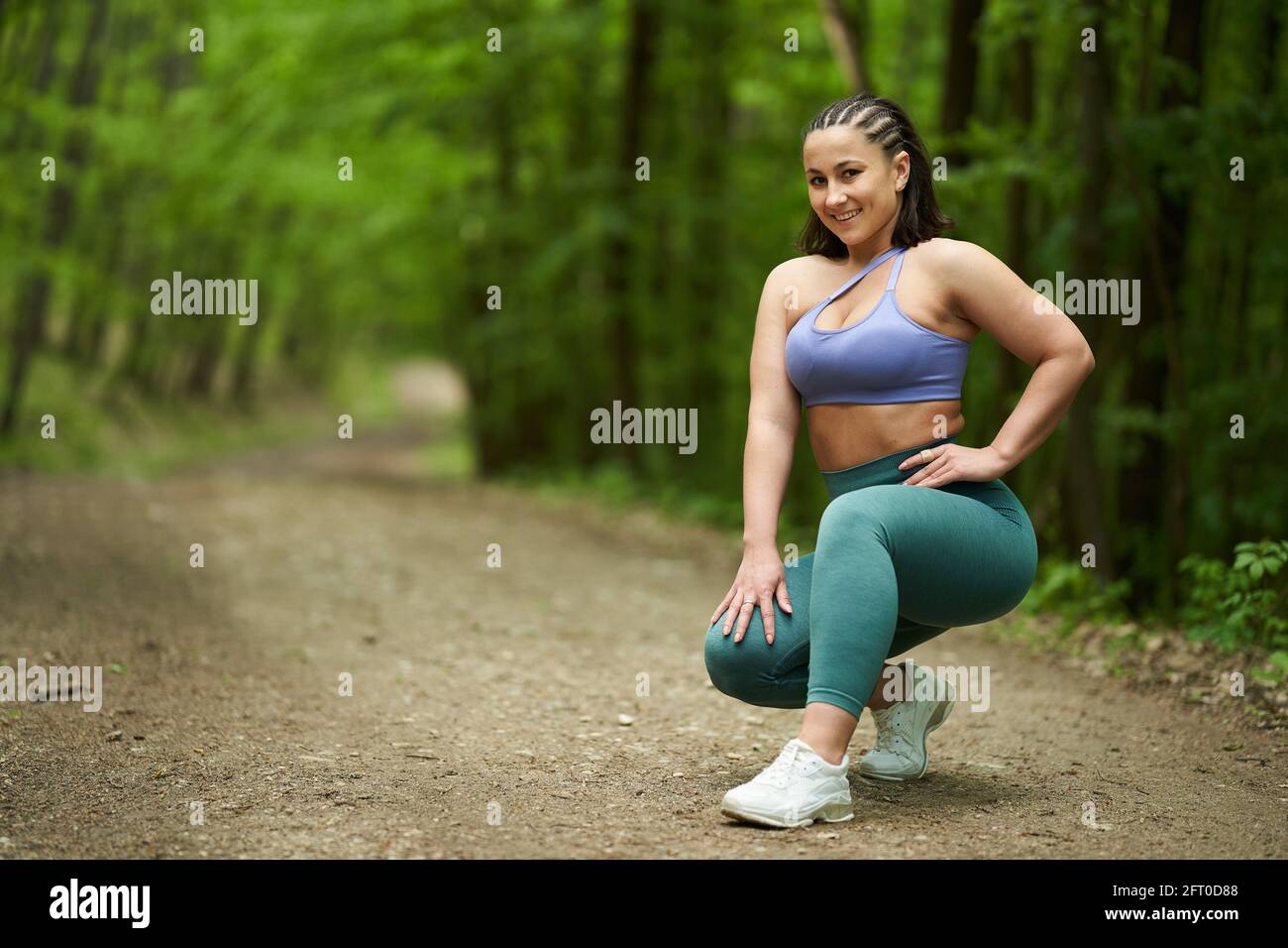 Plus size young beautiful runner woman posing in the forest Stock Photo ...
