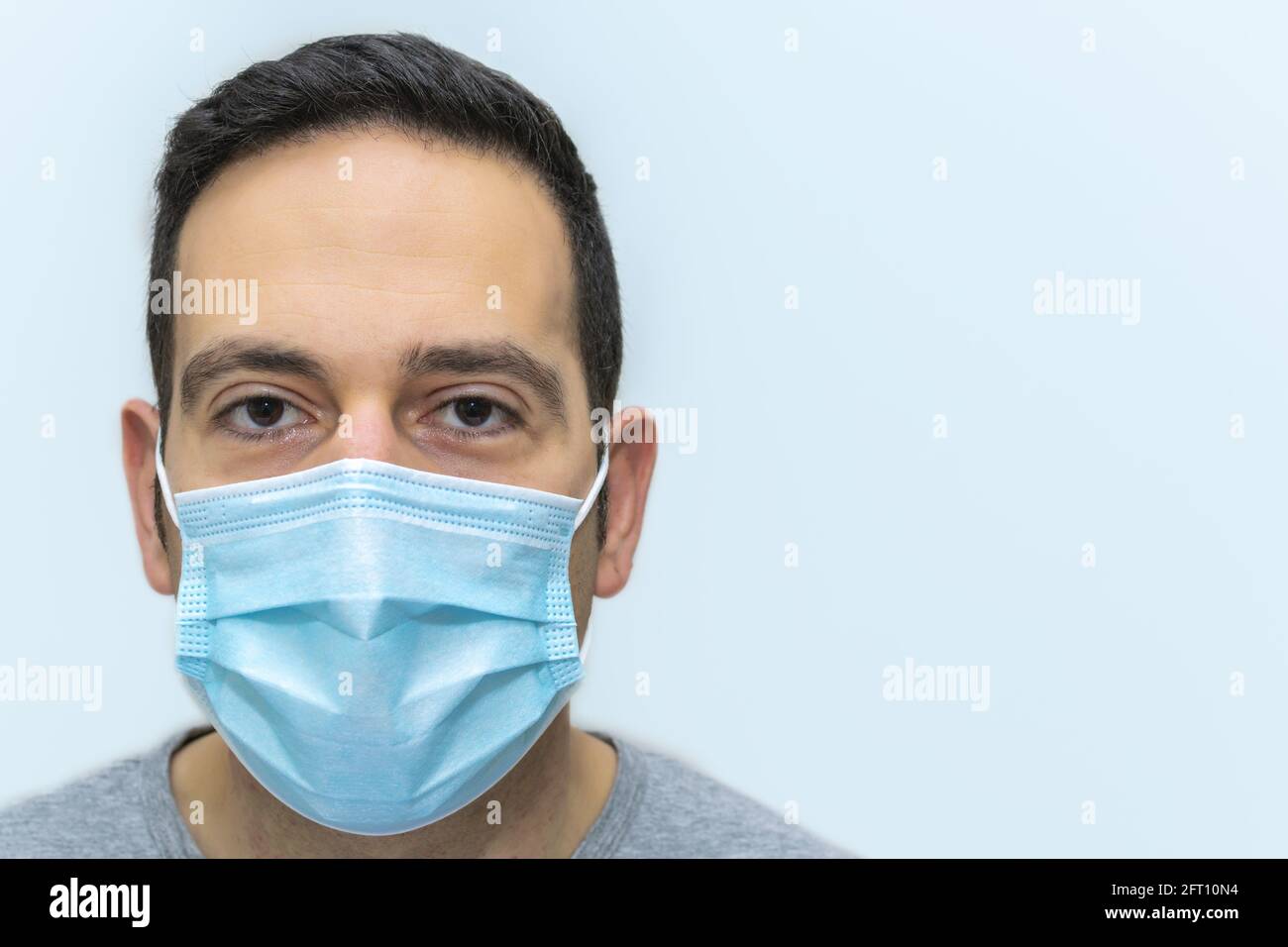 Portrait of a young male wearing a face mask Stock Photo - Alamy