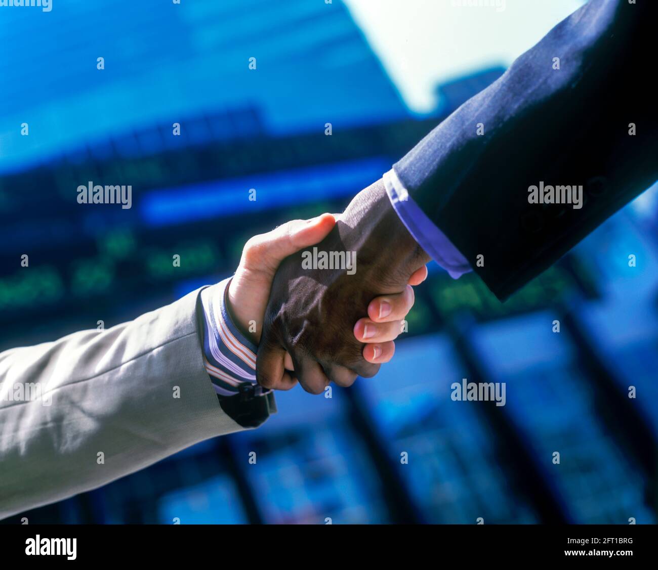 2005 HISTORICAL OFFICE WORKERS CLOSE UP HANDSHAKE BY STOCK MARKET ...