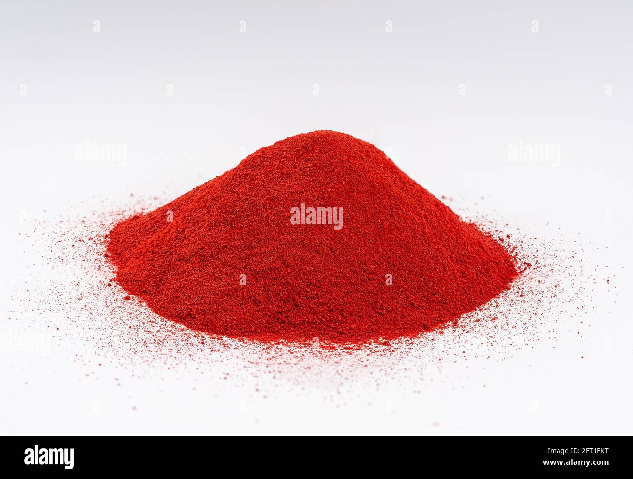 food powder in red color on white background, front view, macro photo ...
