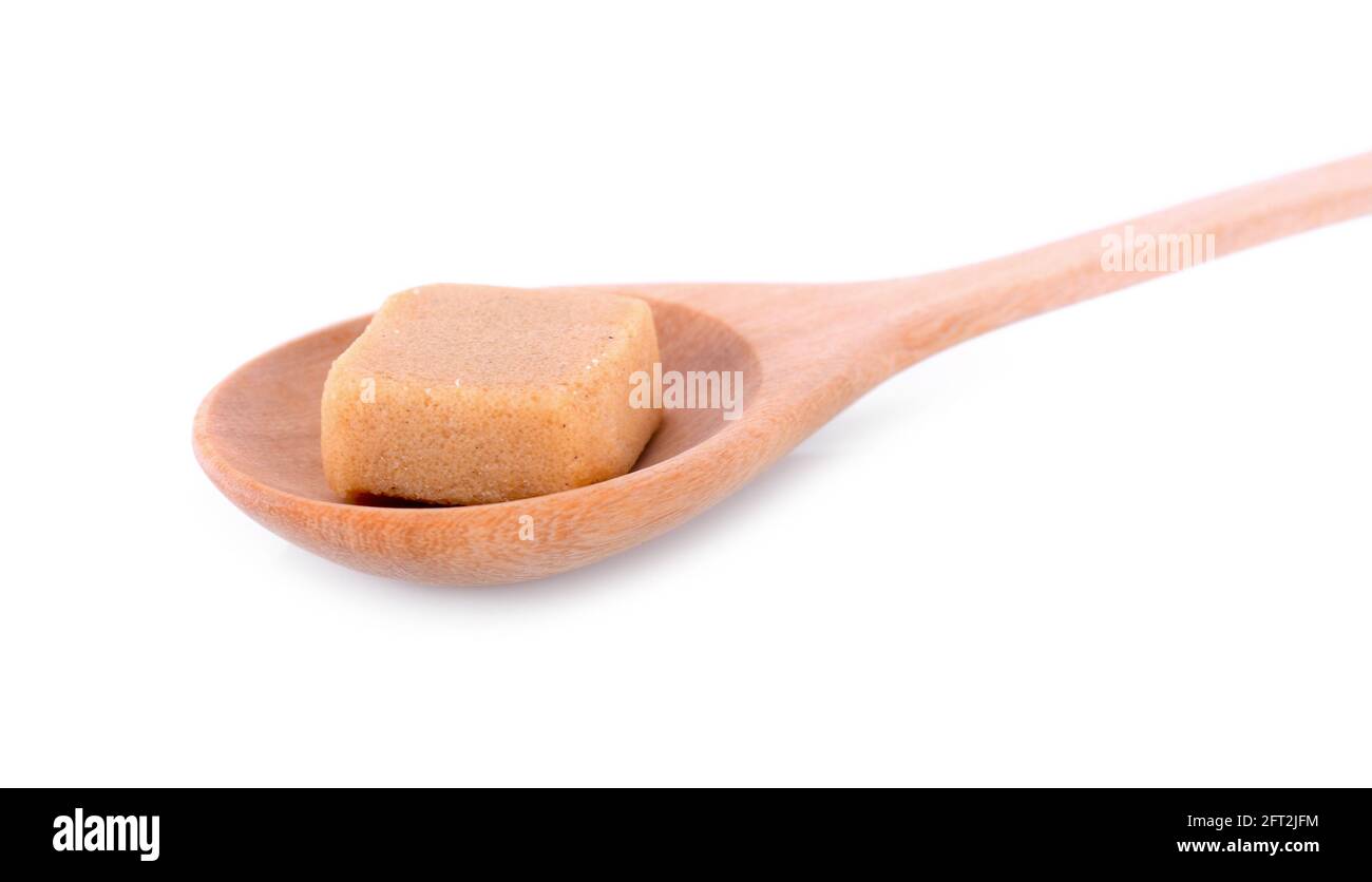 Cubes soup with spoon isolated on white Stock Photo - Alamy