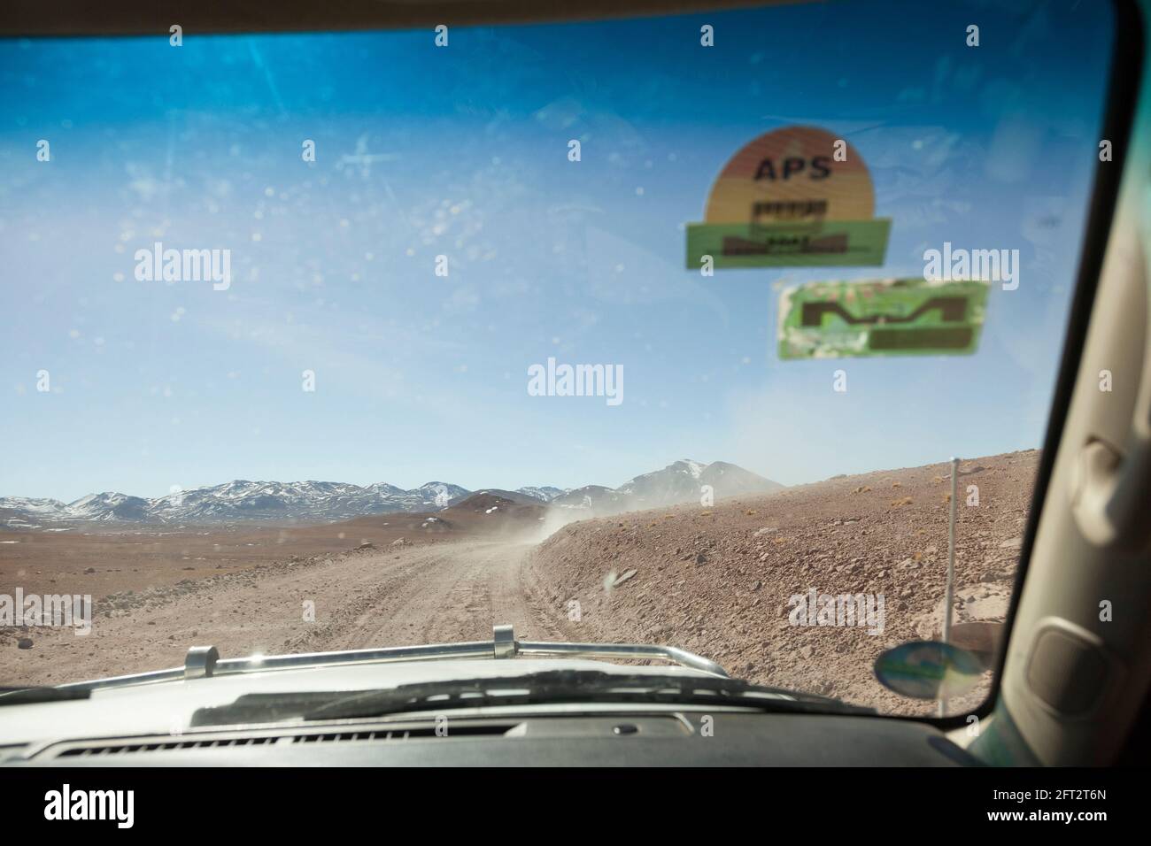 Viewed from the front passenger seat, a 4x4 vehicle drives along a ...