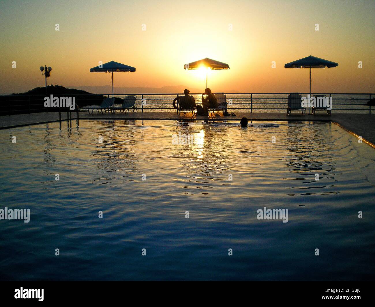 Swimming pool at twilight, Crete, Greece Stock Photo - Alamy
