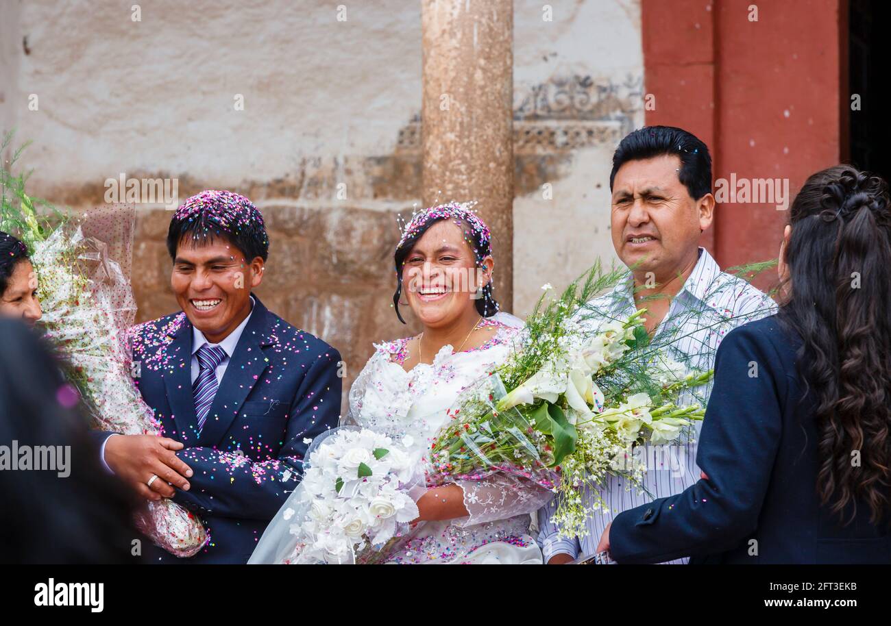 Smiling Quechua bride and groom at a traditional local wedding ...