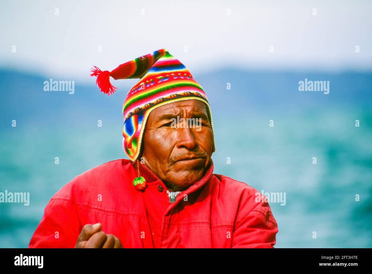 Close-up portrait of a local Peruvian man, a boatman on Lake Titicaca ...