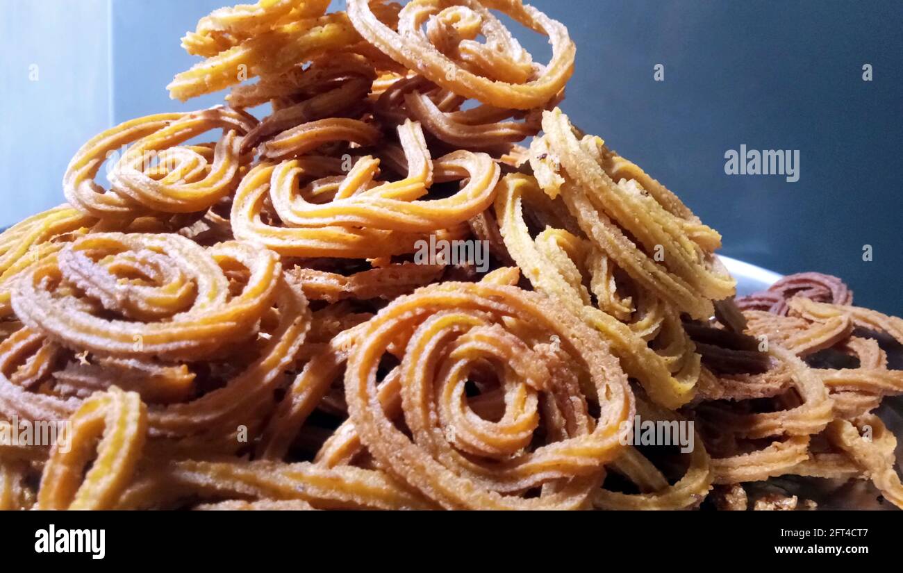 Indian Traditional Snack Chakli, a spiral shaped crisp deep fried snack ...
