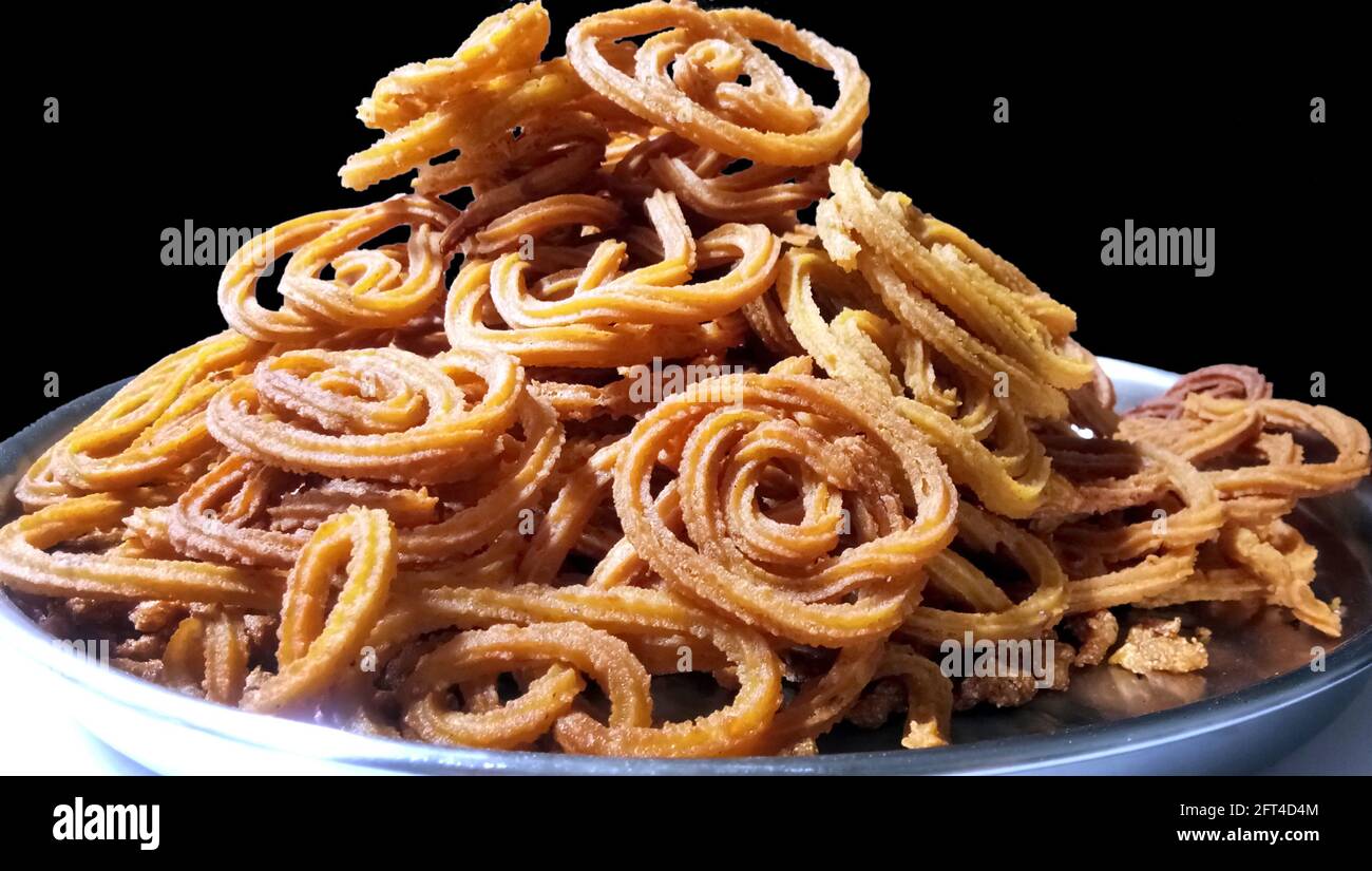 Indian Traditional Snack Chakli, a spiral shaped crisp deep fried snack ...
