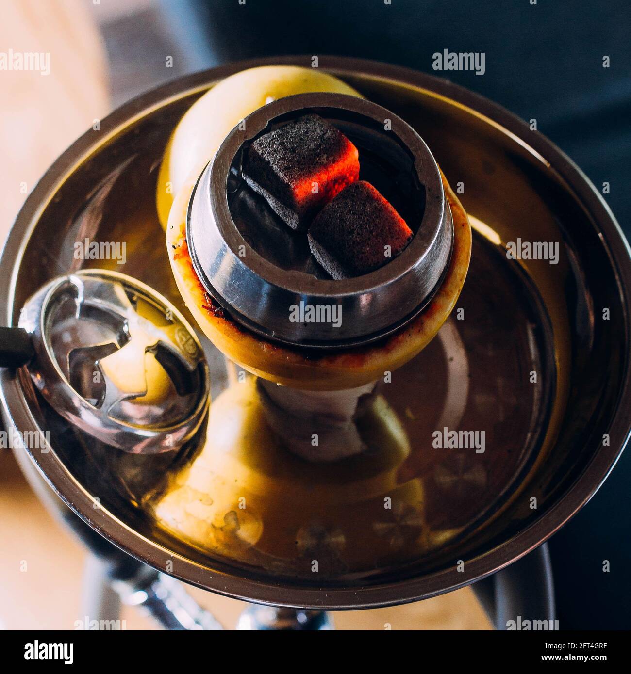 Shisha hookah with red hot coals. Sparks from breathe. Modern hookah ...