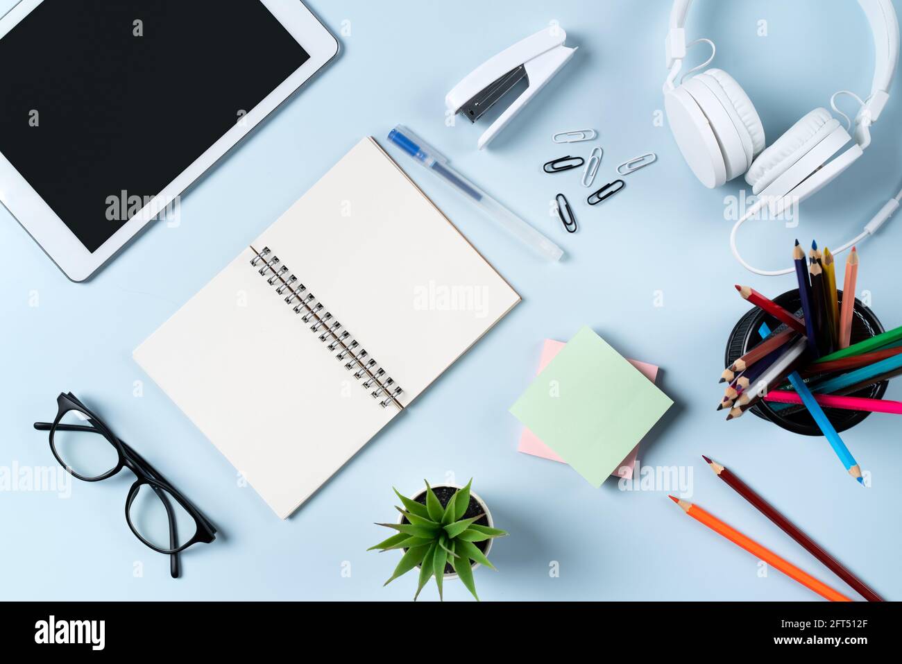 Online learning design concept. Top view of student table with tablet ...