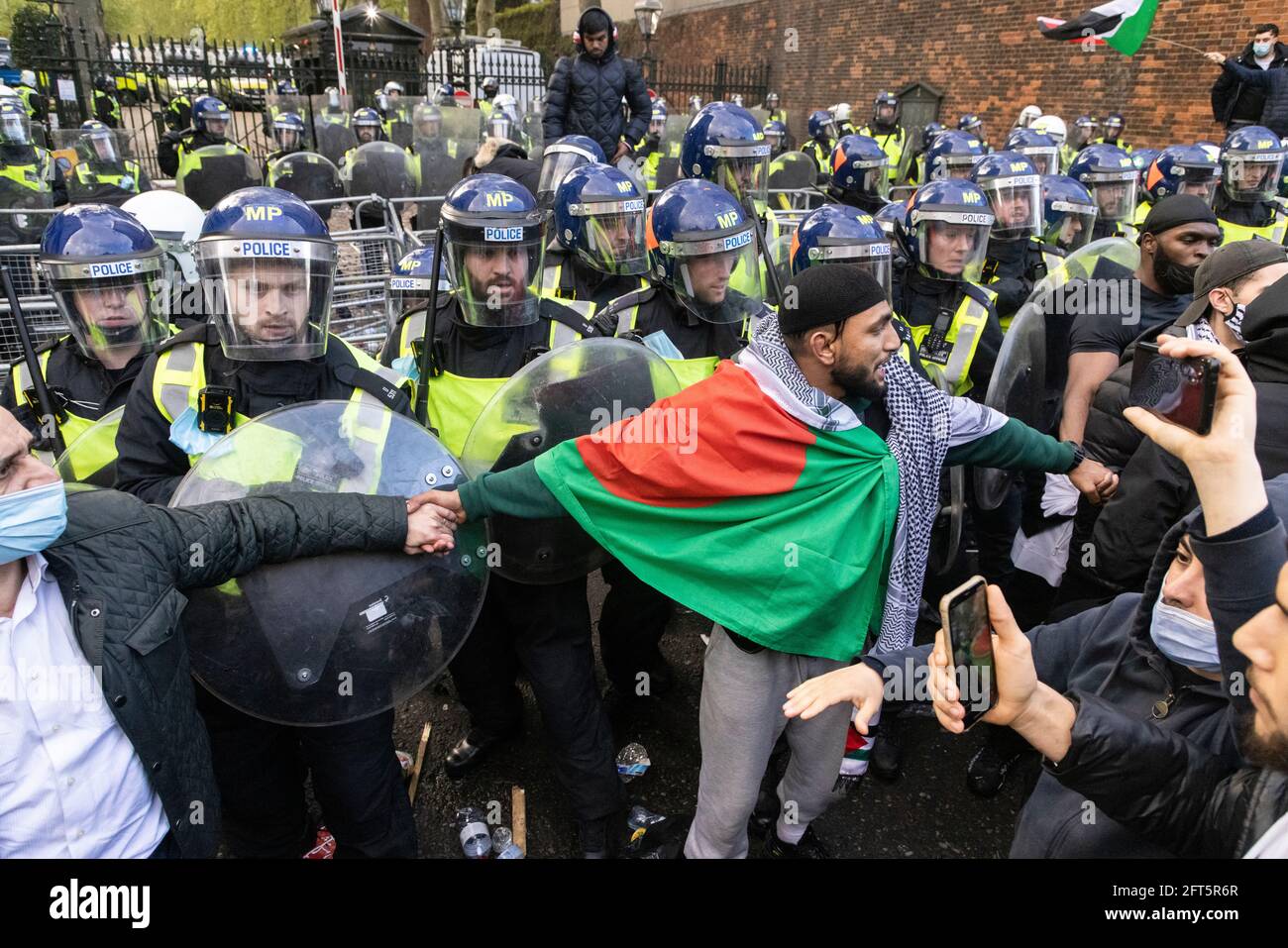 Protesters protecting police officers outside Embassy of Israel, 'Free ...