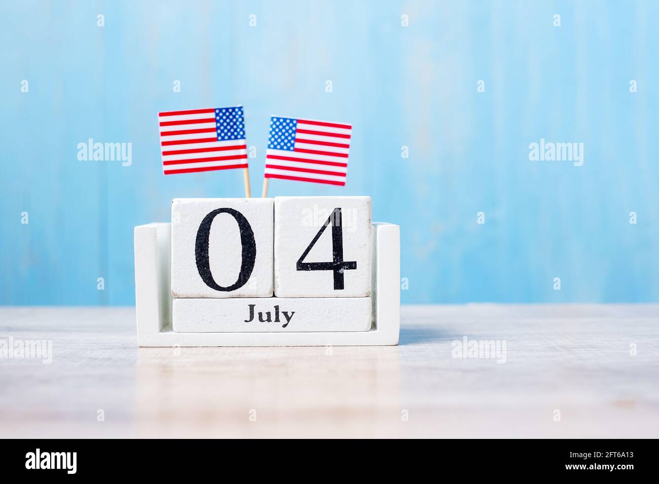 Wooden calendar of July 4th with miniature United States of America ...