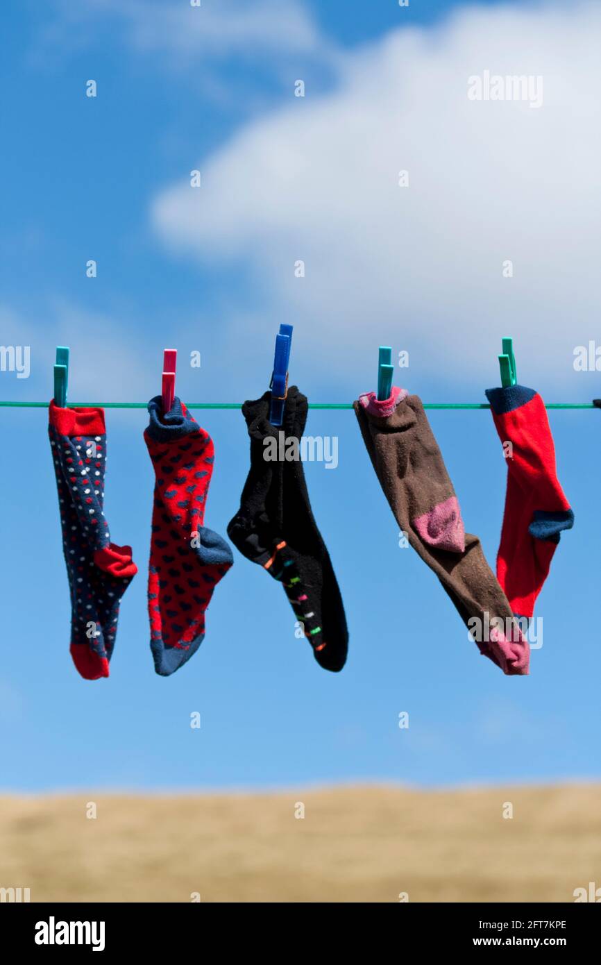 Childs socks on washing line Stock Photo - Alamy