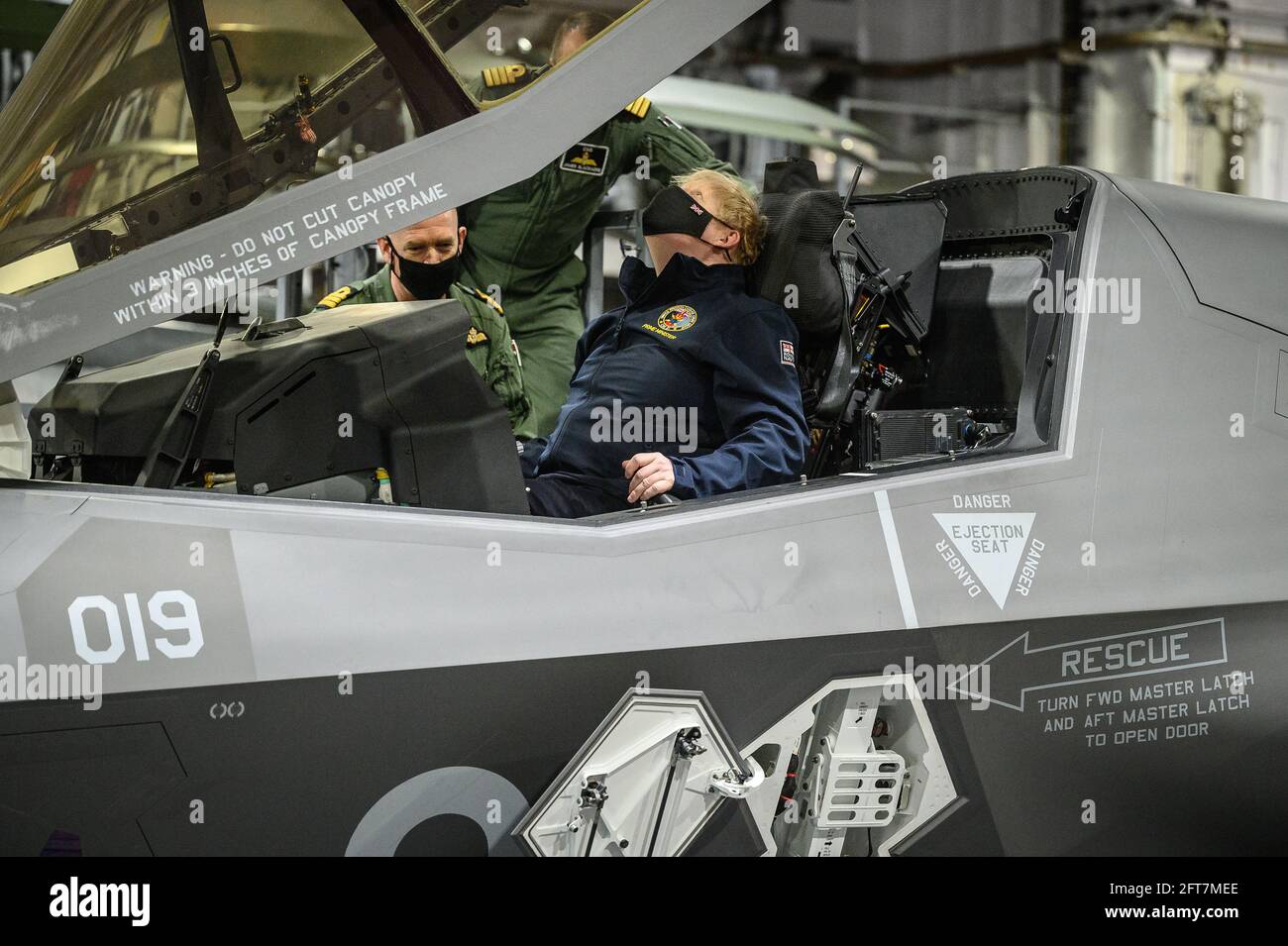 Prime Minister Boris Johnson sits in the cockpit of an Lockheed Martin ...