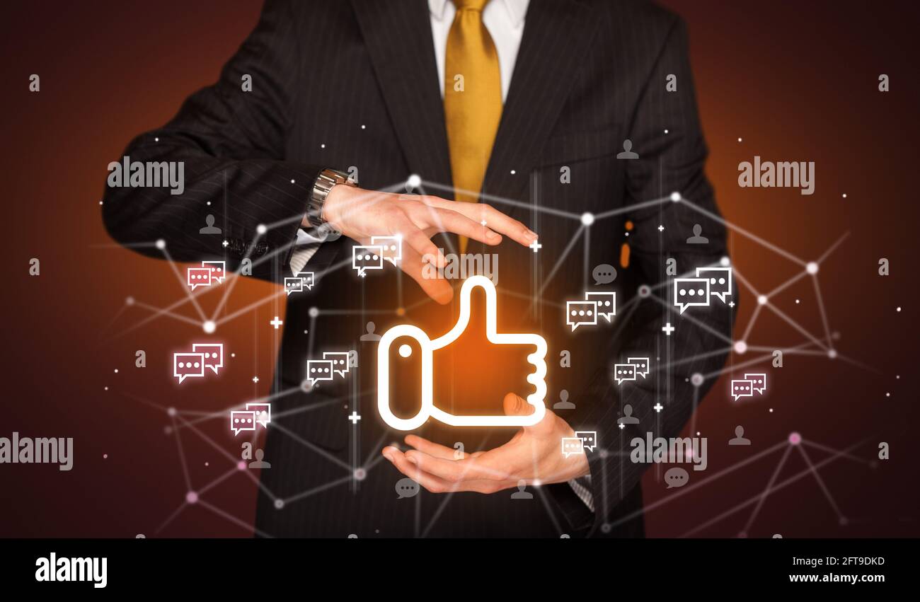 Hand holding social media icons Stock Photo - Alamy