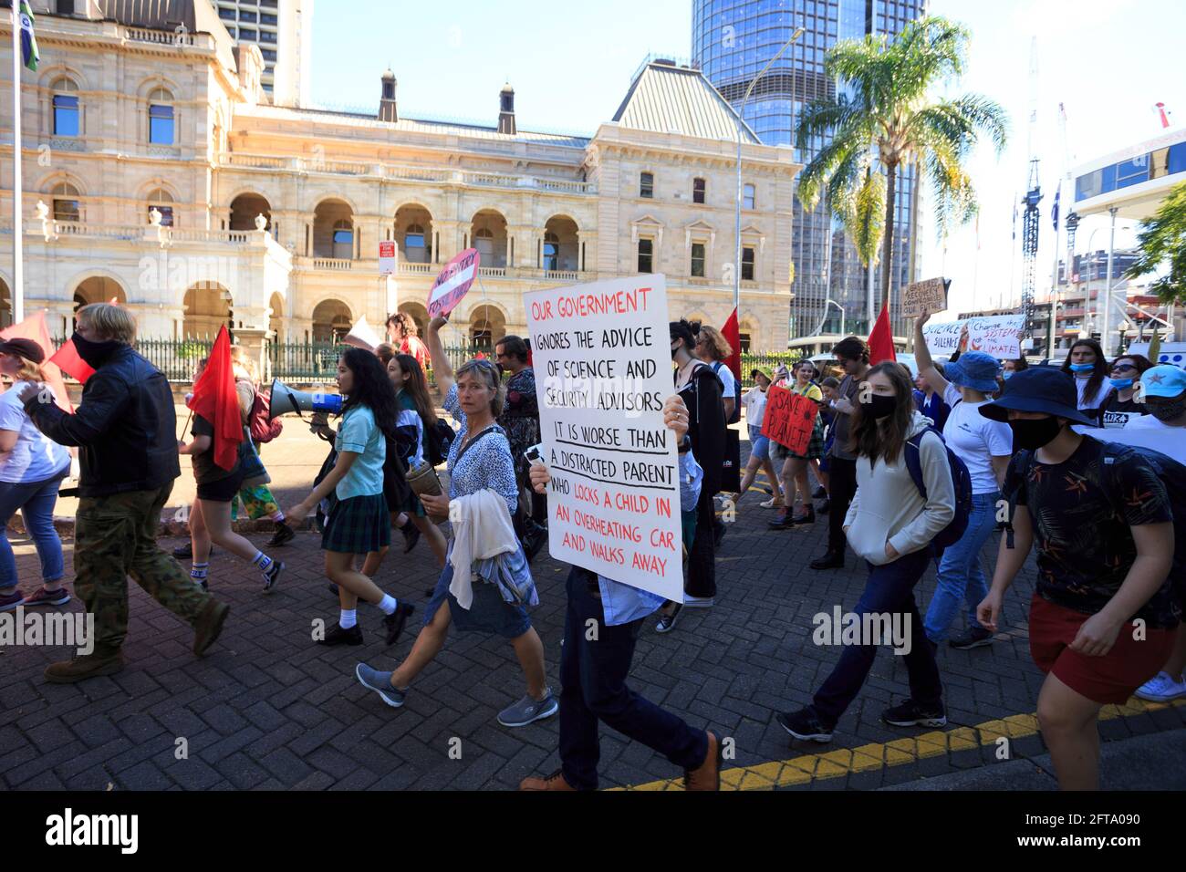 Brisbane, Australia. 21st May, 2021. A protester holds a placard while ...