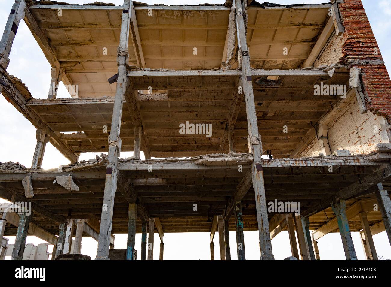 Old abandoned unfinished building damaged by time, wind and rain ...