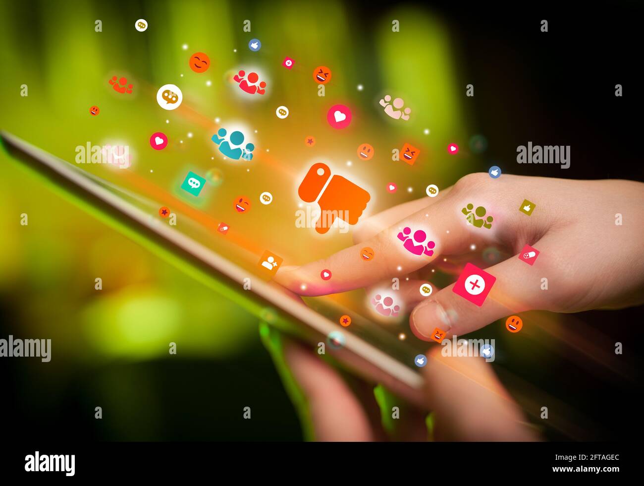 Close-up of a hand using tablet with social media icons Stock Photo - Alamy