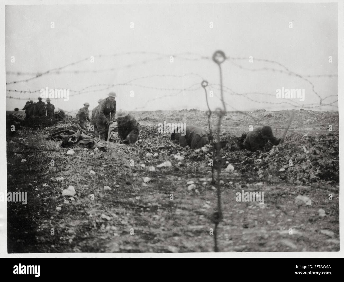 World War One, WWI, Western Front - Men dig a trench, seen through ...