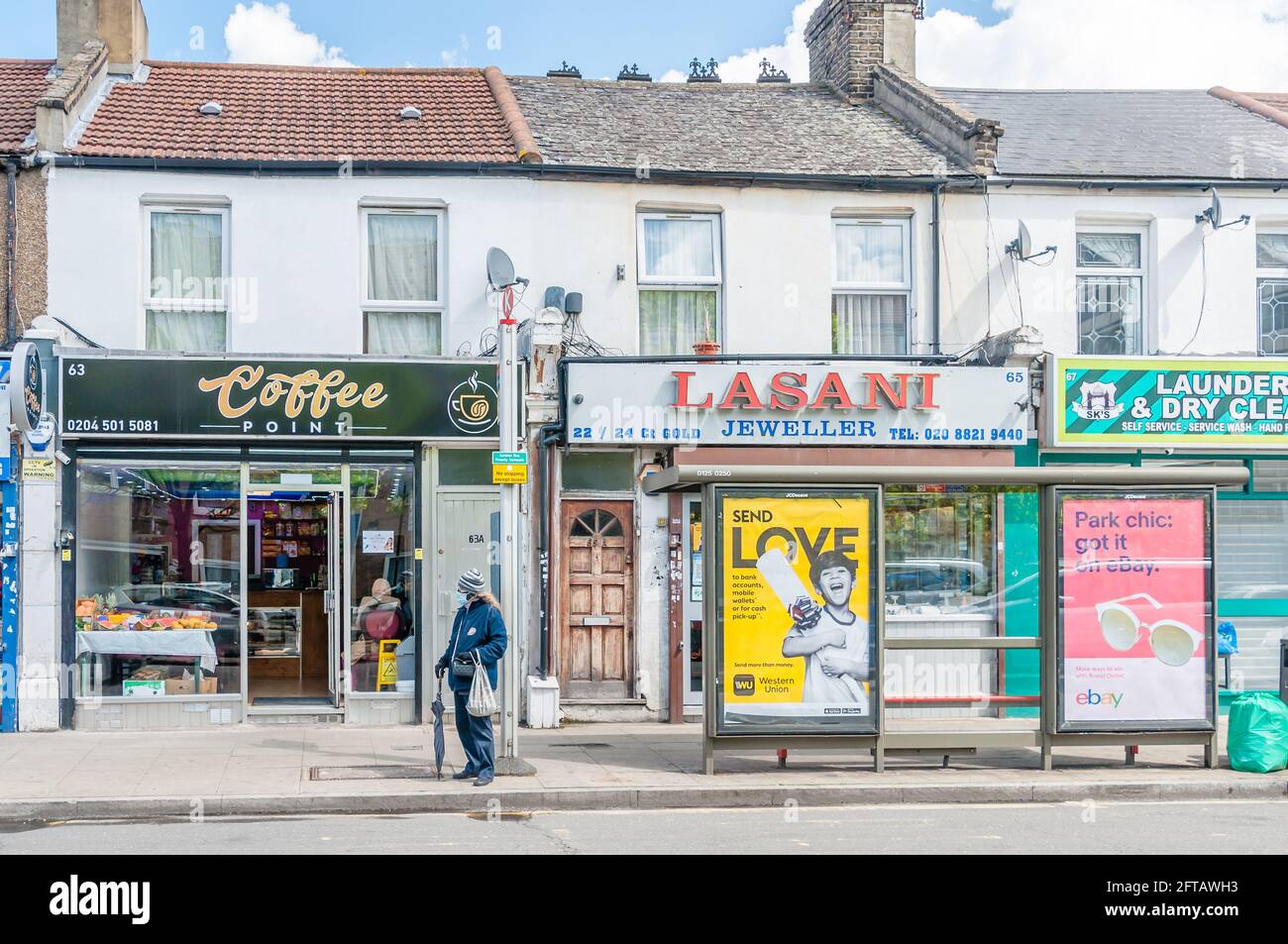 Typical Street with small independent retail shops in London East End a ...